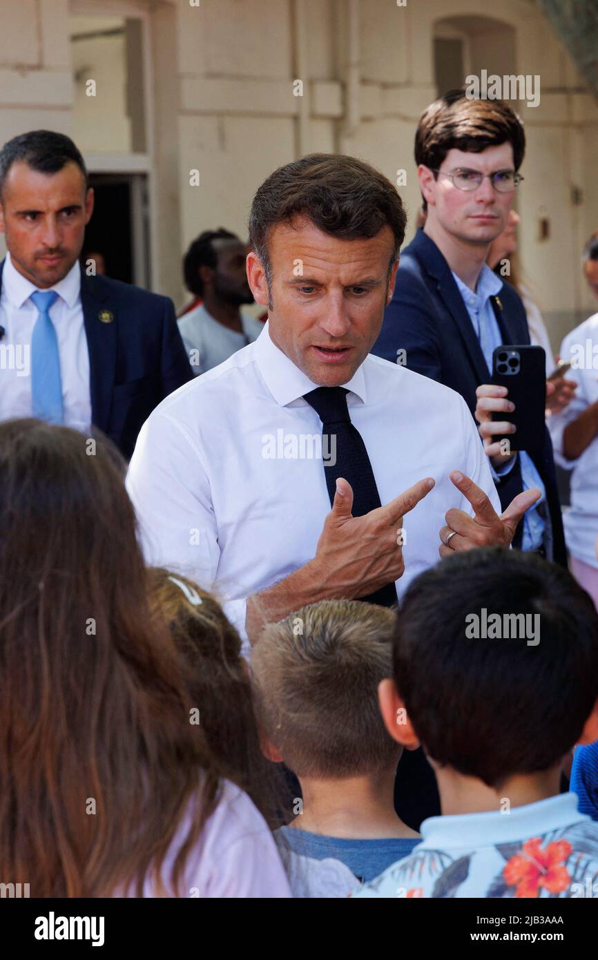 French President Emmanuel Macron during a visit to the Menpenti school ...