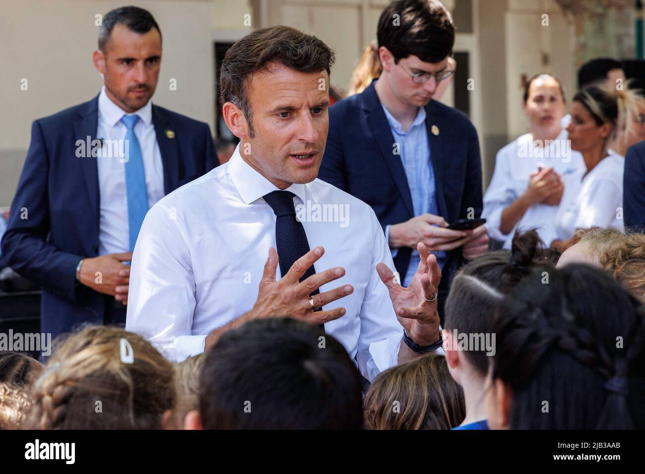 French President Emmanuel Macron during a visit to the Menpenti school ...