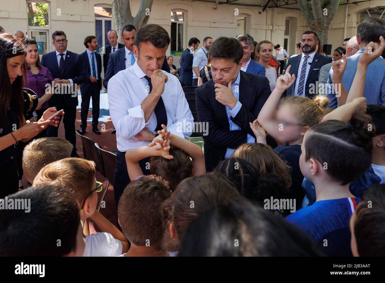 French President Emmanuel Macron during a visit to the Menpenti school ...