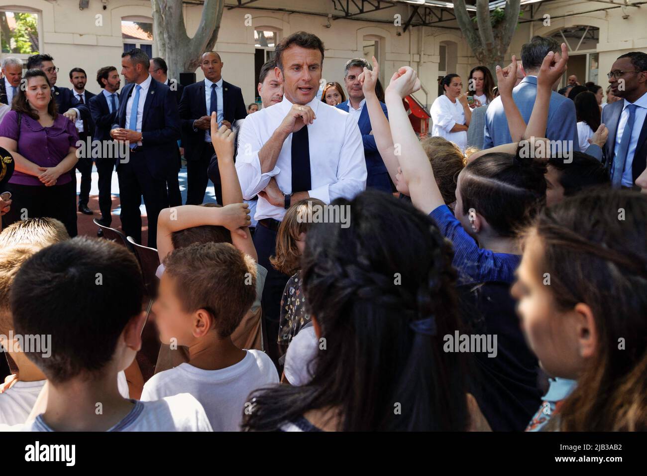 French President Emmanuel Macron during a visit to the Menpenti school ...