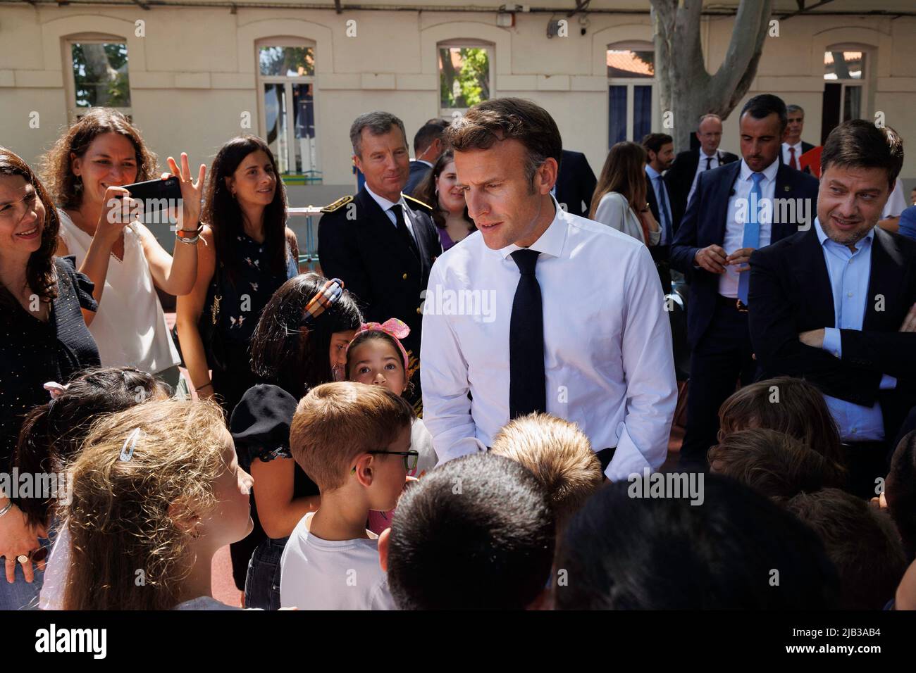 French President Emmanuel Macron during a visit to the Menpenti school ...