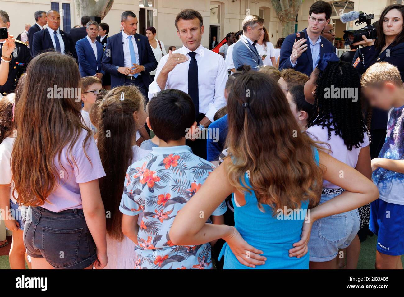French President Emmanuel Macron during a visit to the Menpenti school ...
