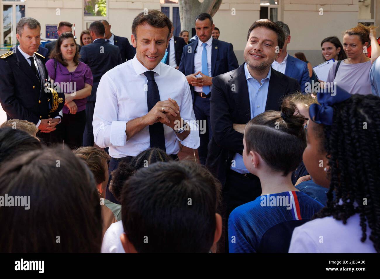 French President Emmanuel Macron during a visit to the Menpenti school ...