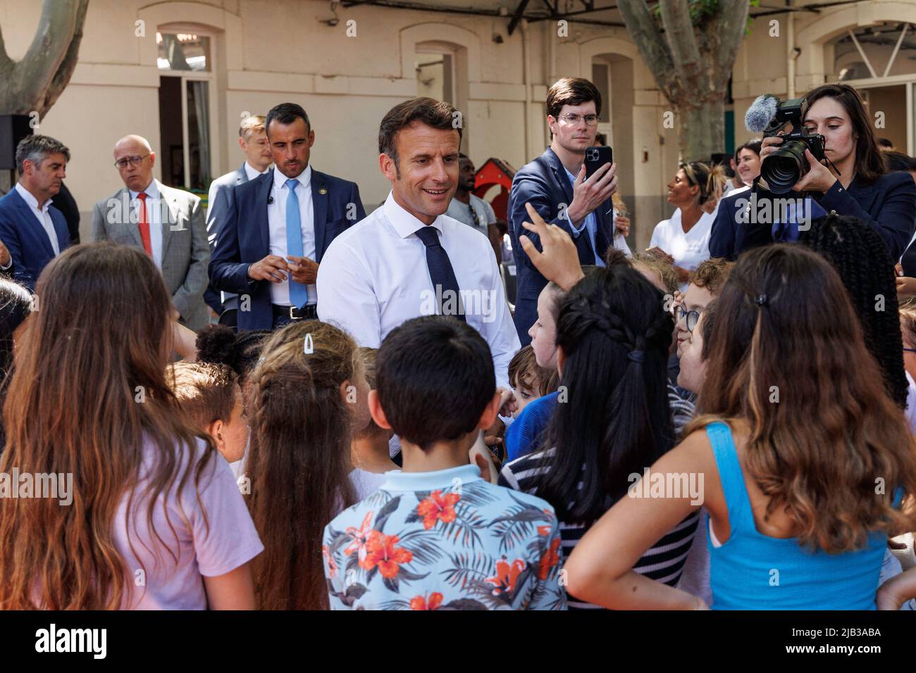 French President Emmanuel Macron during a visit to the Menpenti school ...