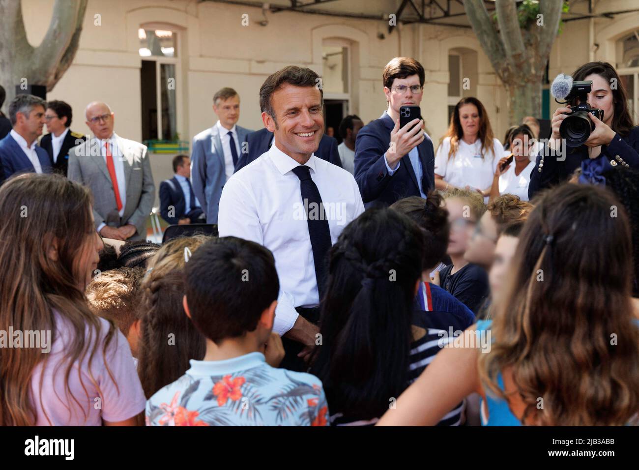 French President Emmanuel Macron during a visit to the Menpenti school ...