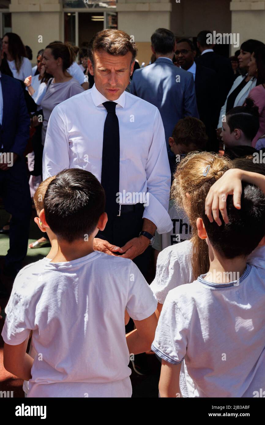 French President Emmanuel Macron during a visit to the Menpenti school ...