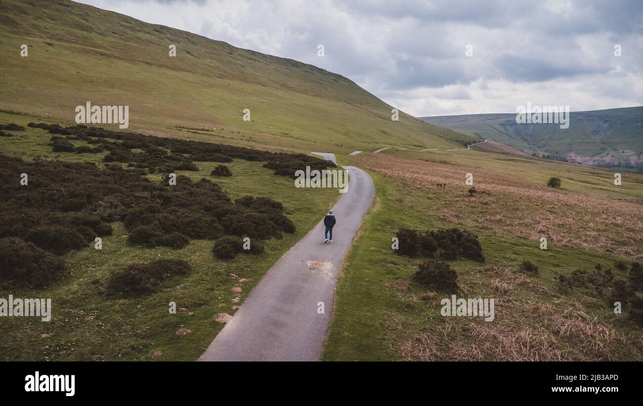 A man walking alone in nature Stock Photo - Alamy