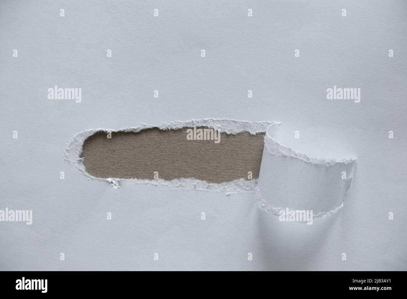 white torn paper with a hole in the middle, torn paper, space for text ...