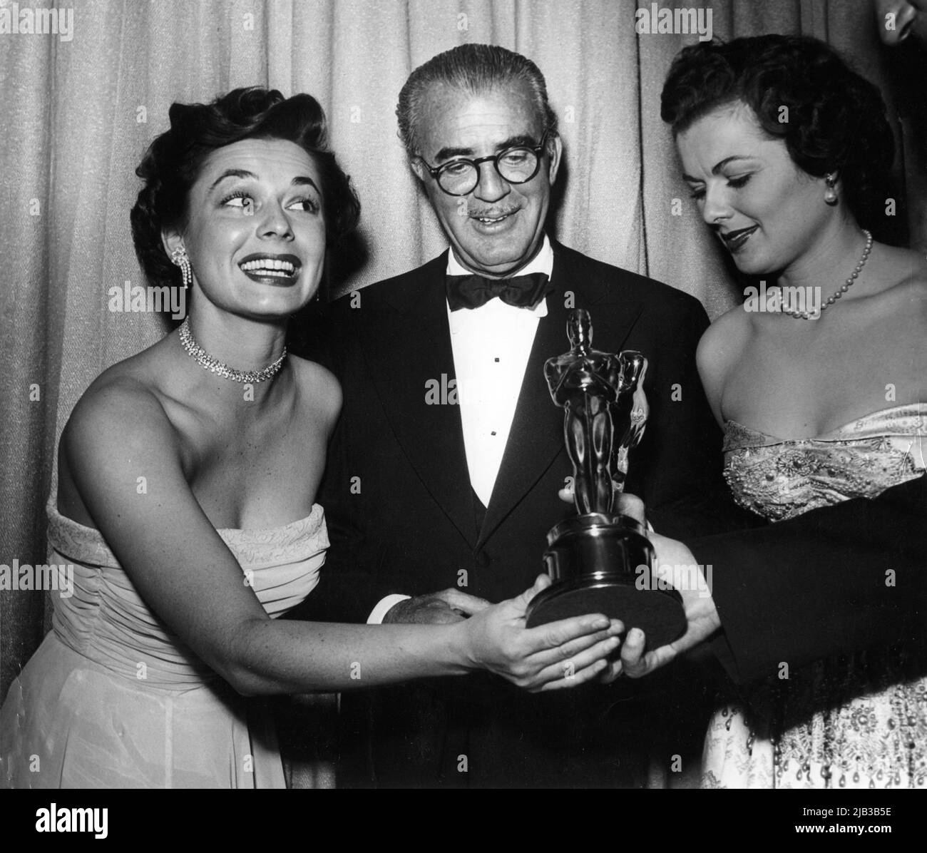 Actresses RUTH ROMAN and BARBARA HALE with MGM Art Director CEDRIC ...