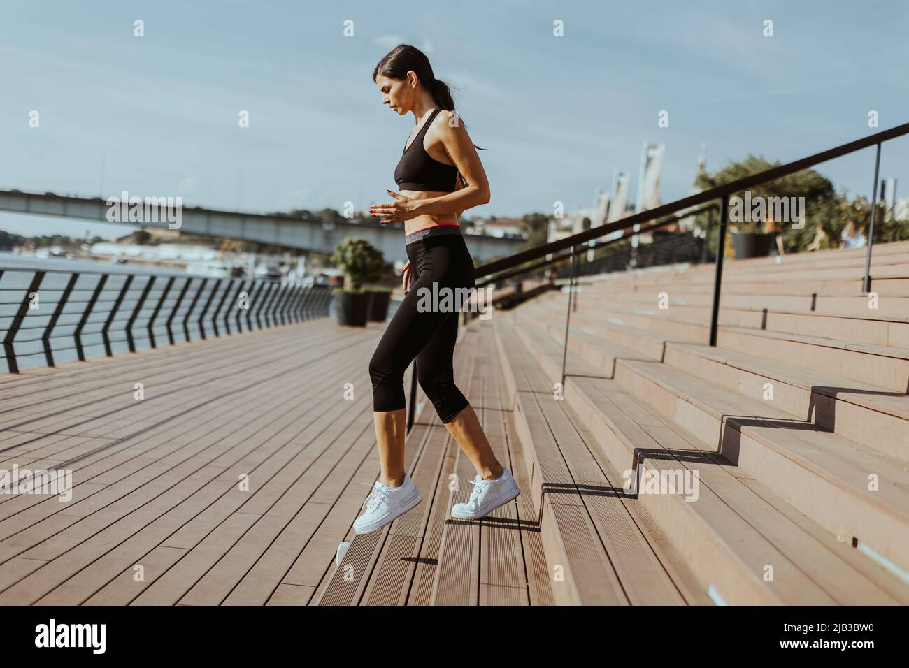 Fit woman jogging river hi-res stock photography and images - Alamy