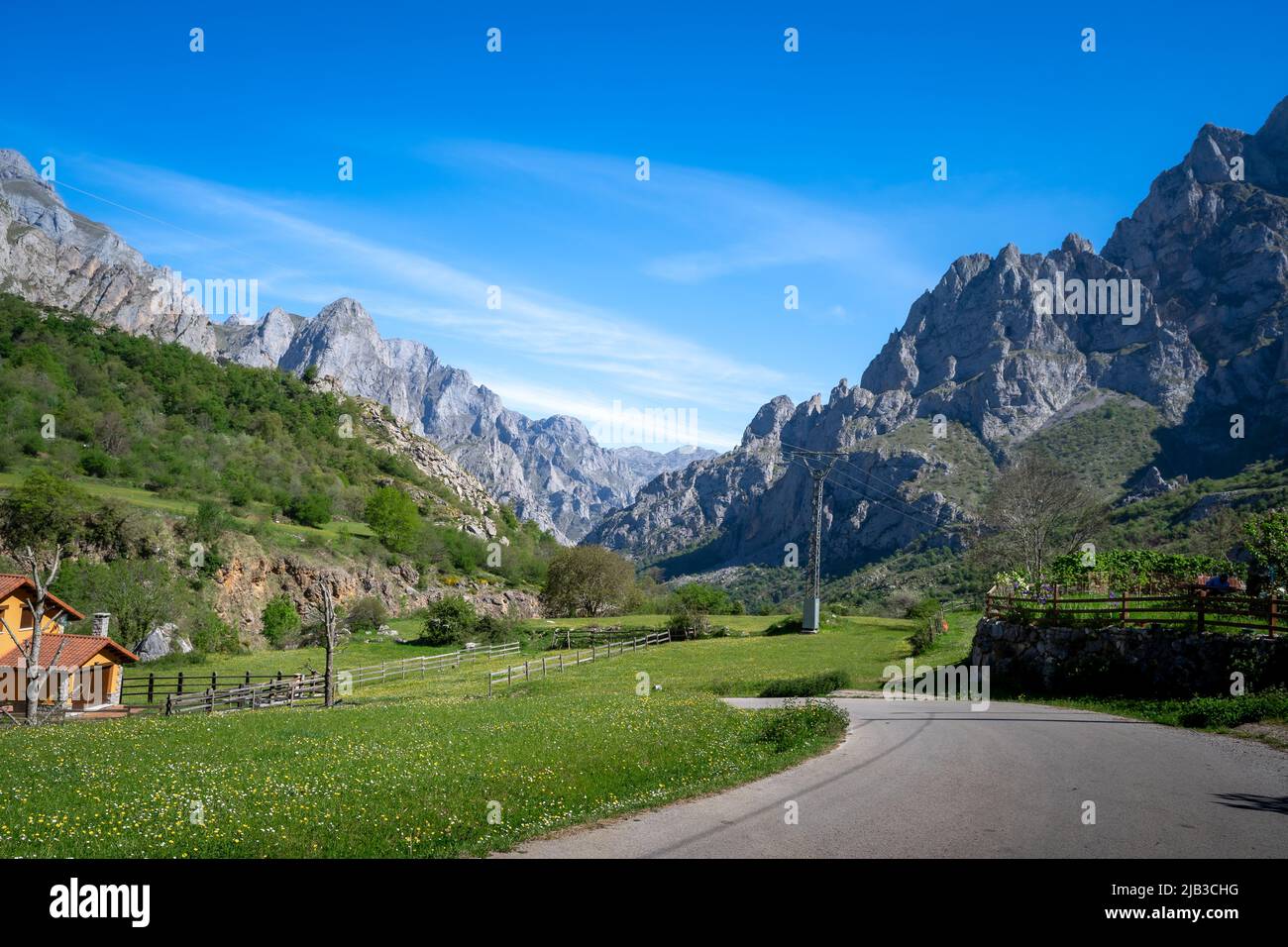 Road to Cain de Valdeón with Picos de Europa mountains in the ...