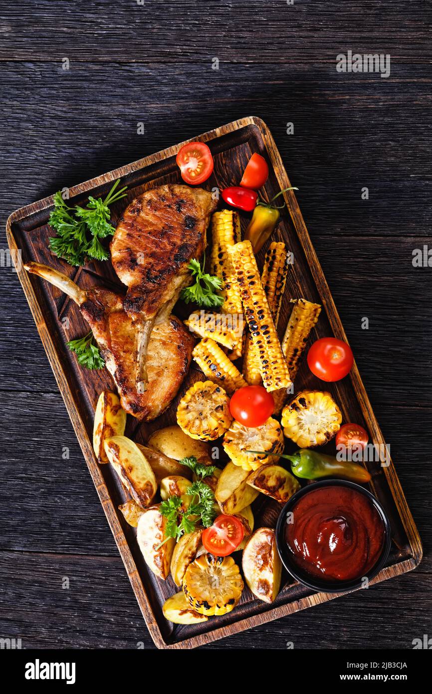 roasted tomahawk pork chops with grilled corn disks and corn ribs ...