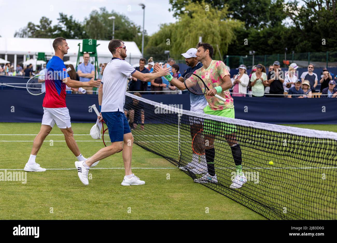 Filip Polasek and Jamie Murray shake hands with Divij Sharan and Artem ...
