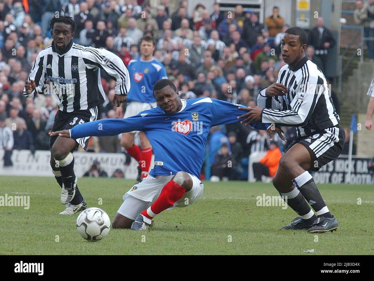 PORTSMOUTH V NEWCASTLE YAKUBU IS PULLED BACK BY TITUS BRAMBLE PIC MIKE ...