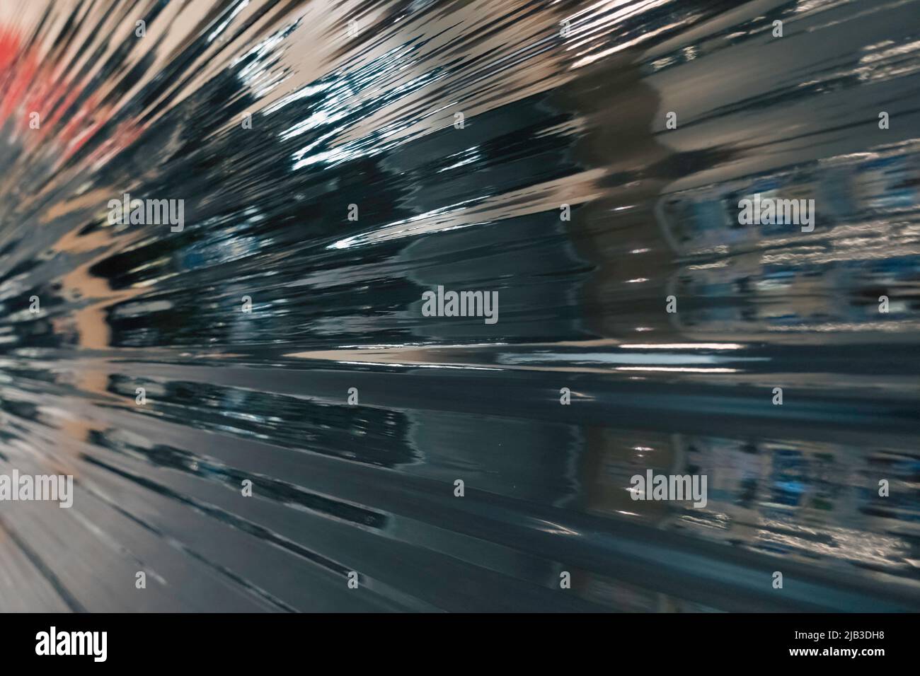 Black plastic wrap background. Crumpled wrinkled plastic cellophane ...