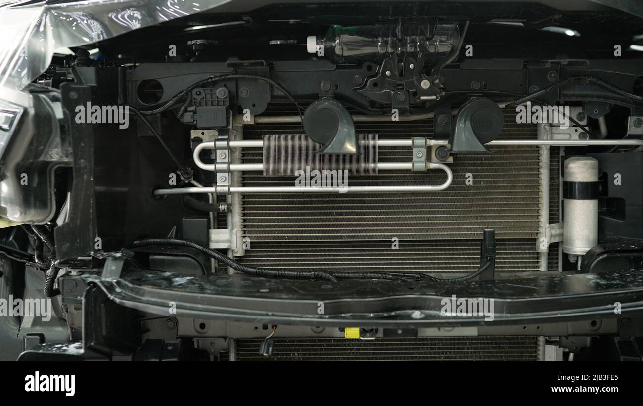 Radiator under the hood of a car. Car with open hood. Car with open ...