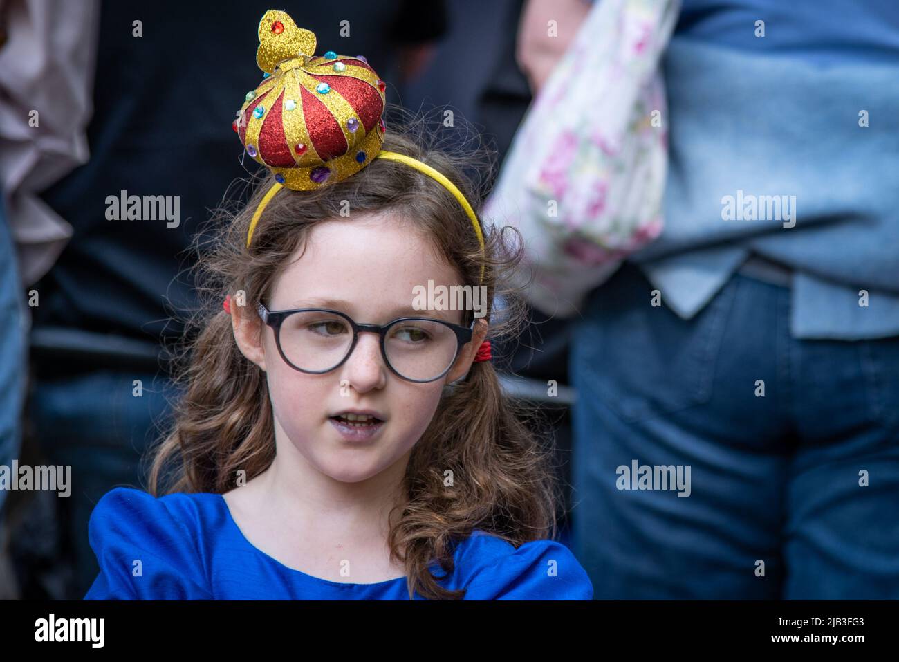 A young fan is adorned with a crown during the Queen Elizabeth II ...