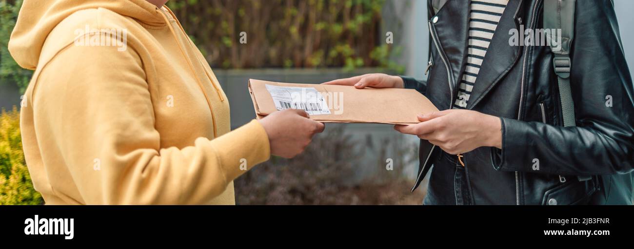 Courier service delivery woman giving paper mail letter parcel to ...