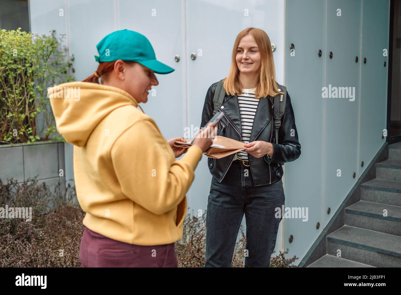 Courier service delivery woman giving paper mail letter parcel to ...
