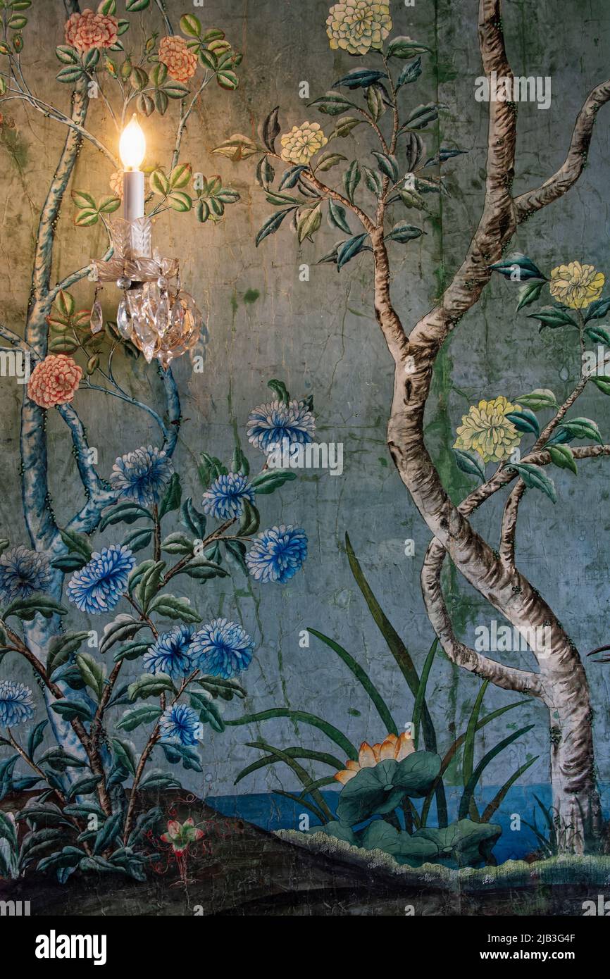 The ornate hand painted wallpaper of the Long Hill estate illuminated ...