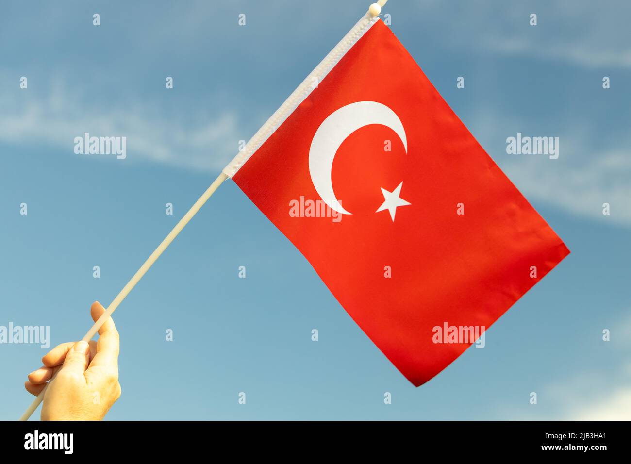 Turkey flag held in hand, Concept, Country officially renamed Turkiye ...