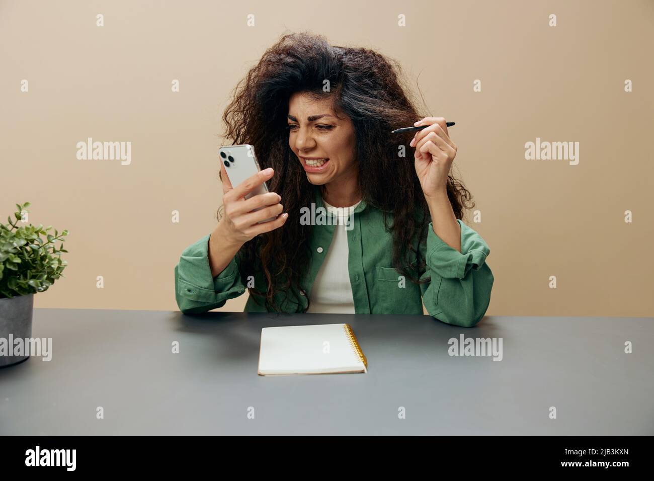 Confused irritated angry tanned curly Latin lady have problems sit at ...