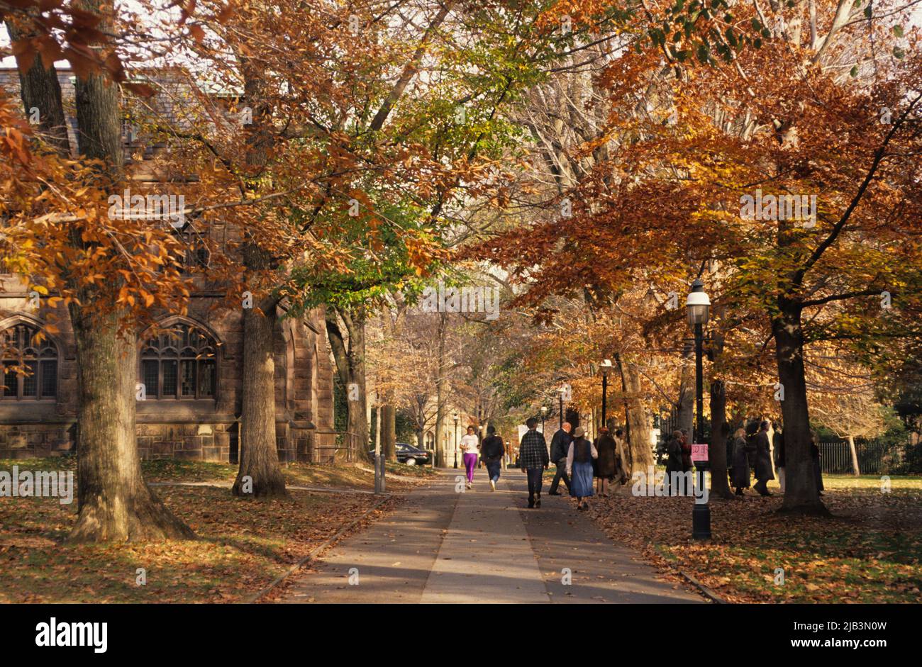 Princeton University campus in the autumn. Group of people walking on a ...