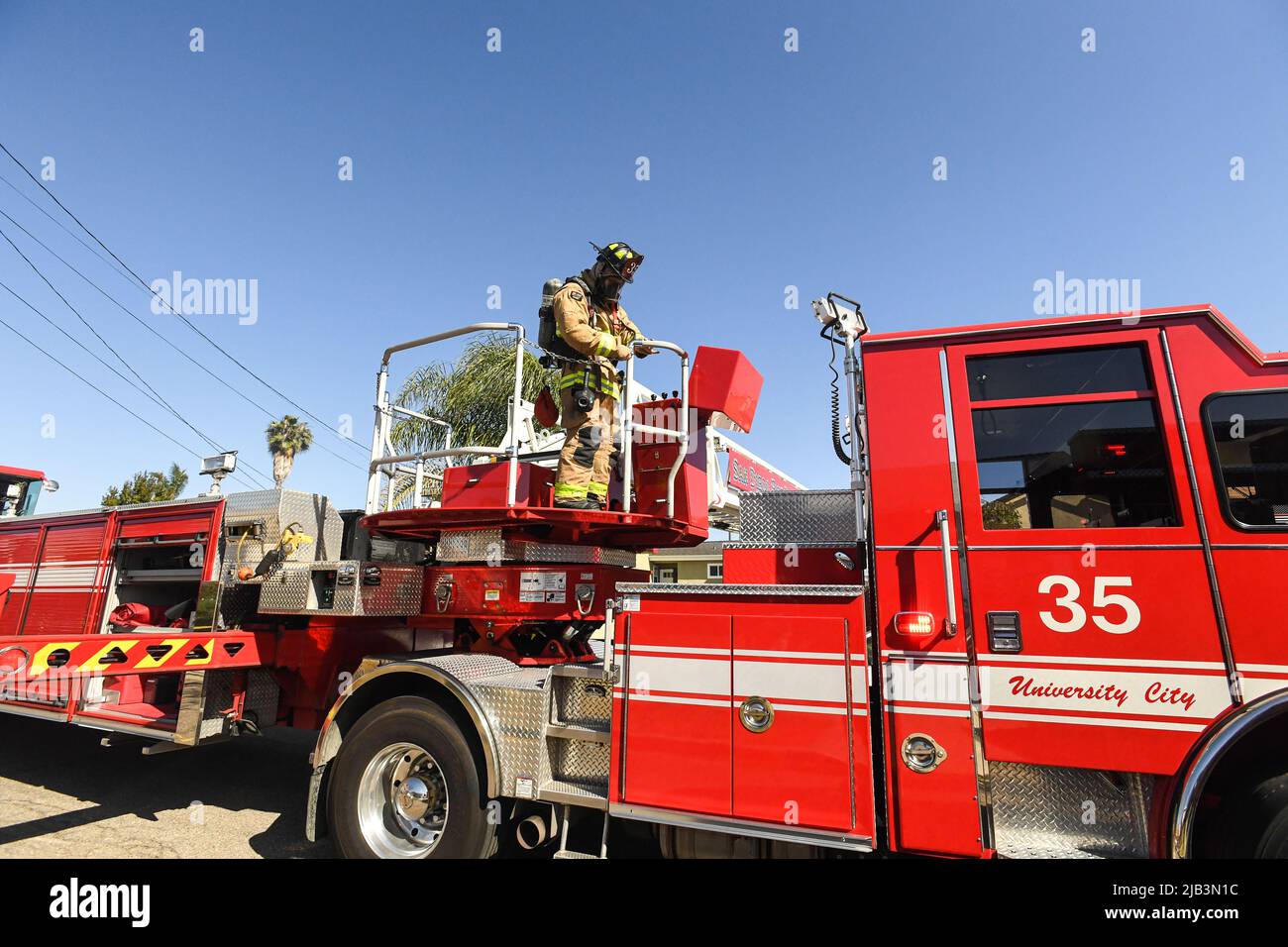 San Diego Fire Rescue Firefighter secures safety chain on Truck 35 ...