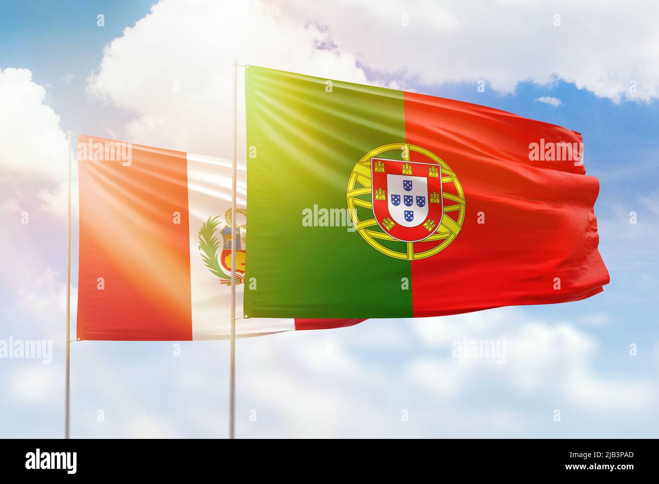 Sunny blue sky and flags of portugal and peru Stock Photo - Alamy