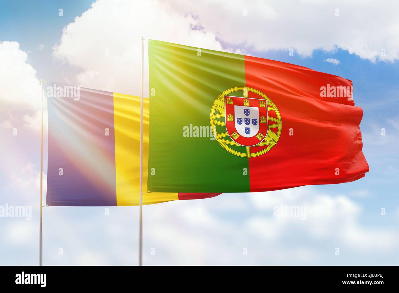 Sunny blue sky and flags of portugal and romania Stock Photo - Alamy