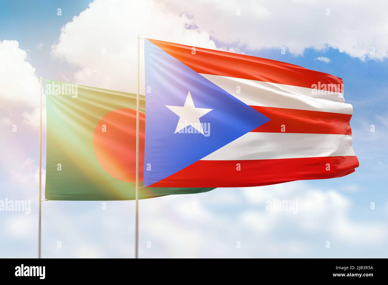Sunny blue sky and flags of puerto rico and bangladesh Stock Photo - Alamy