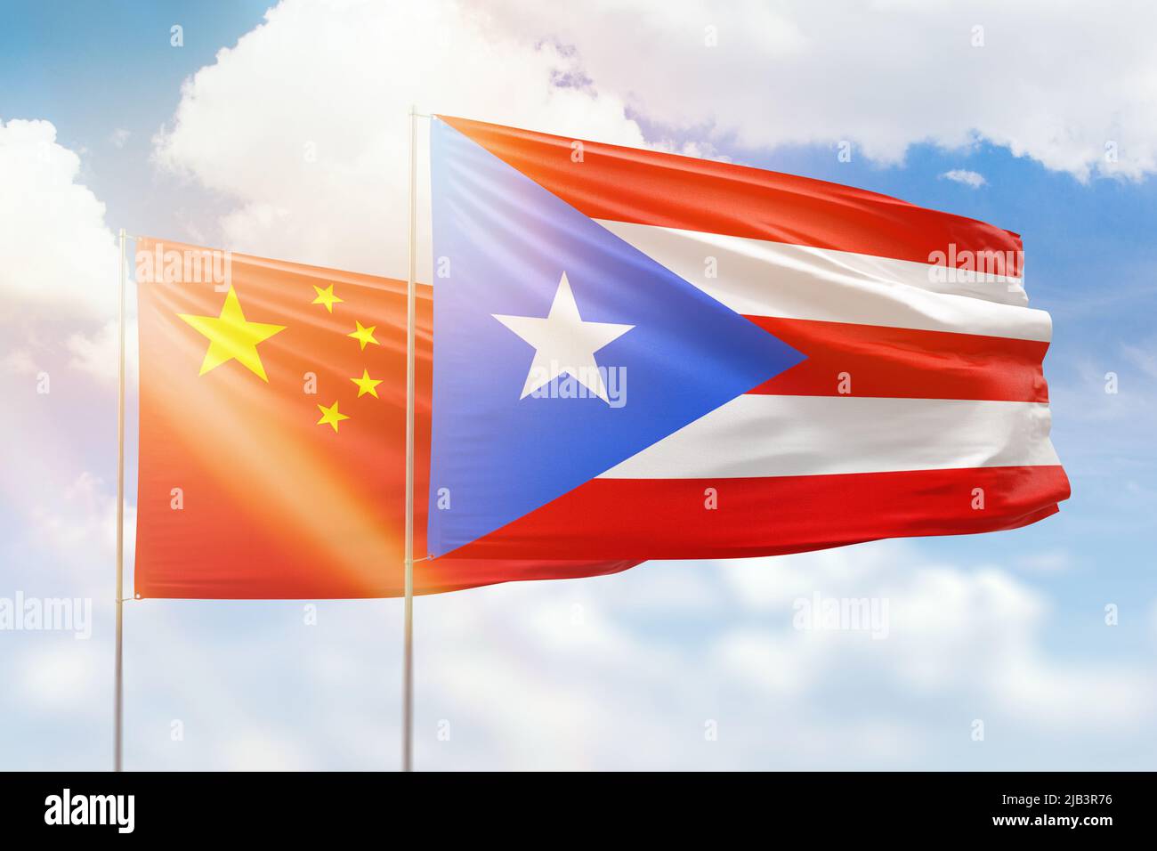 Sunny blue sky and flags of puerto rico and china Stock Photo - Alamy