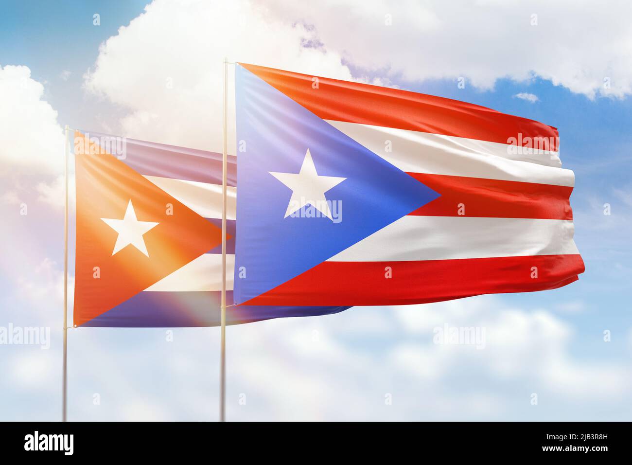 Sunny blue sky and flags of puerto rico and cuba Stock Photo - Alamy