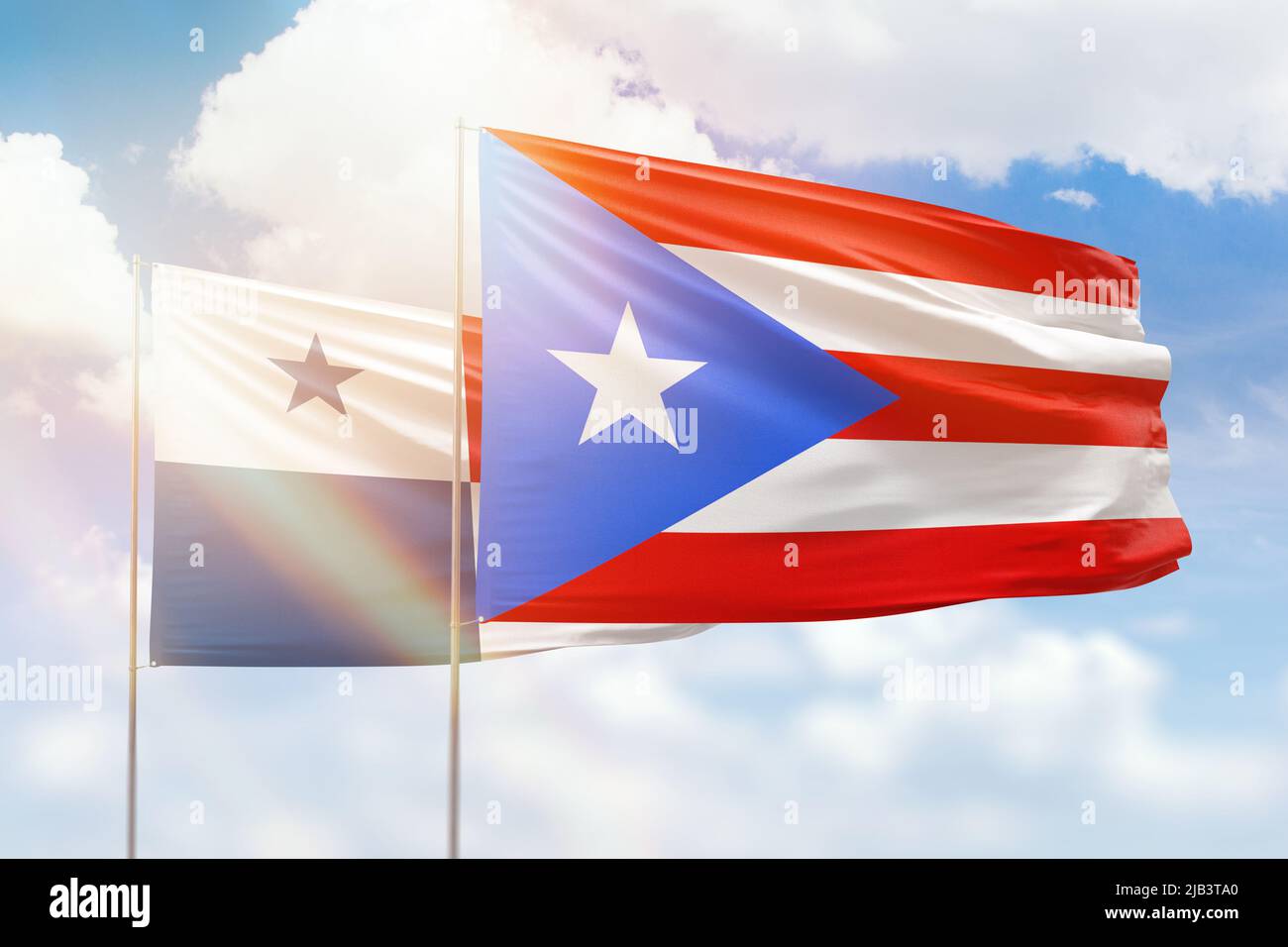 Sunny blue sky and flags of puerto rico and panama Stock Photo - Alamy