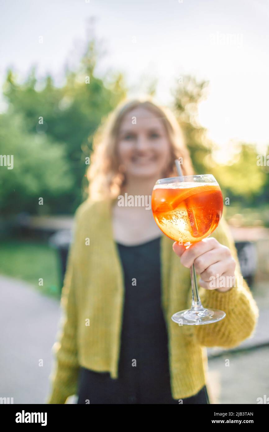 Beautiful European 30s girl having fun in cafe and drinking fruit ...