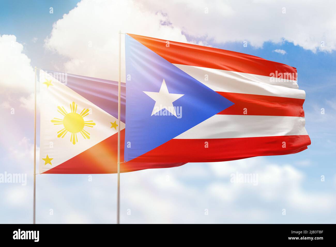 Sunny blue sky and flags of puerto rico and philippines Stock Photo - Alamy