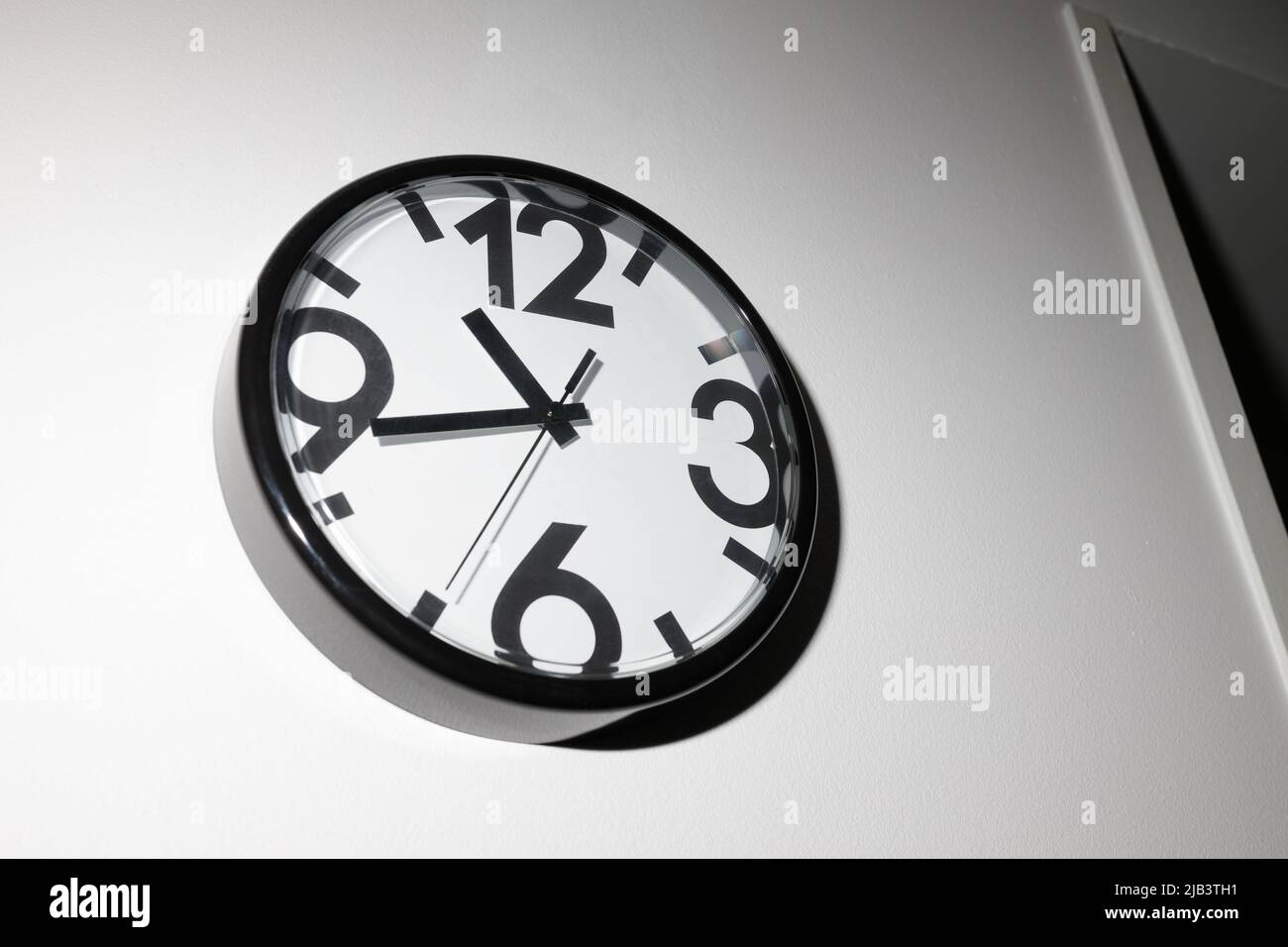 time concept with watch or clock on white wall Stock Photo - Alamy
