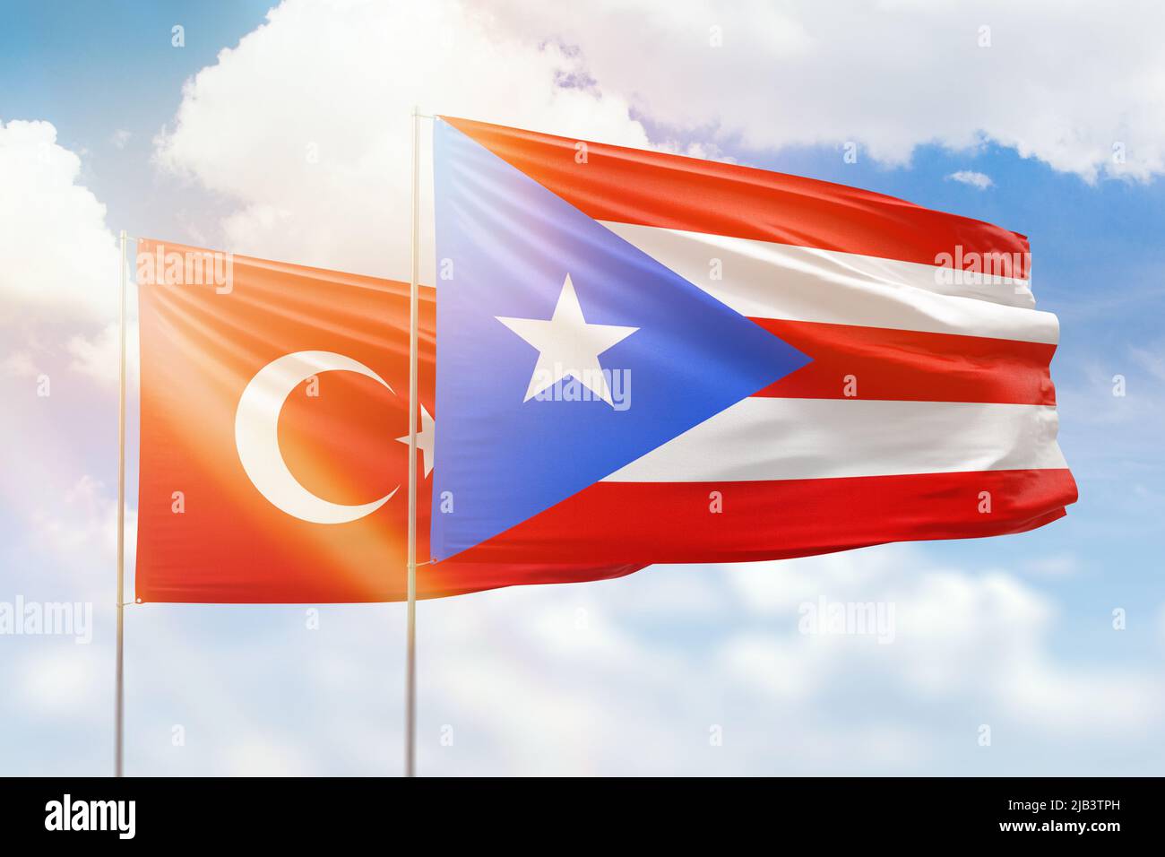 Sunny blue sky and flags of puerto rico and turkey Stock Photo - Alamy