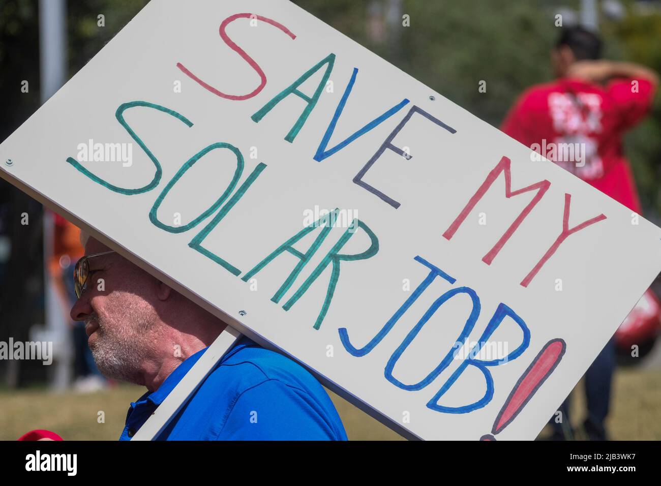 Los Angeles, California, USA. 2nd June, 2022. A solar worker holding a ...