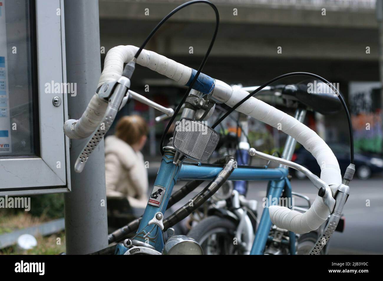 Beautiful elegant retro bicycle with white curved handlebar and blue ...