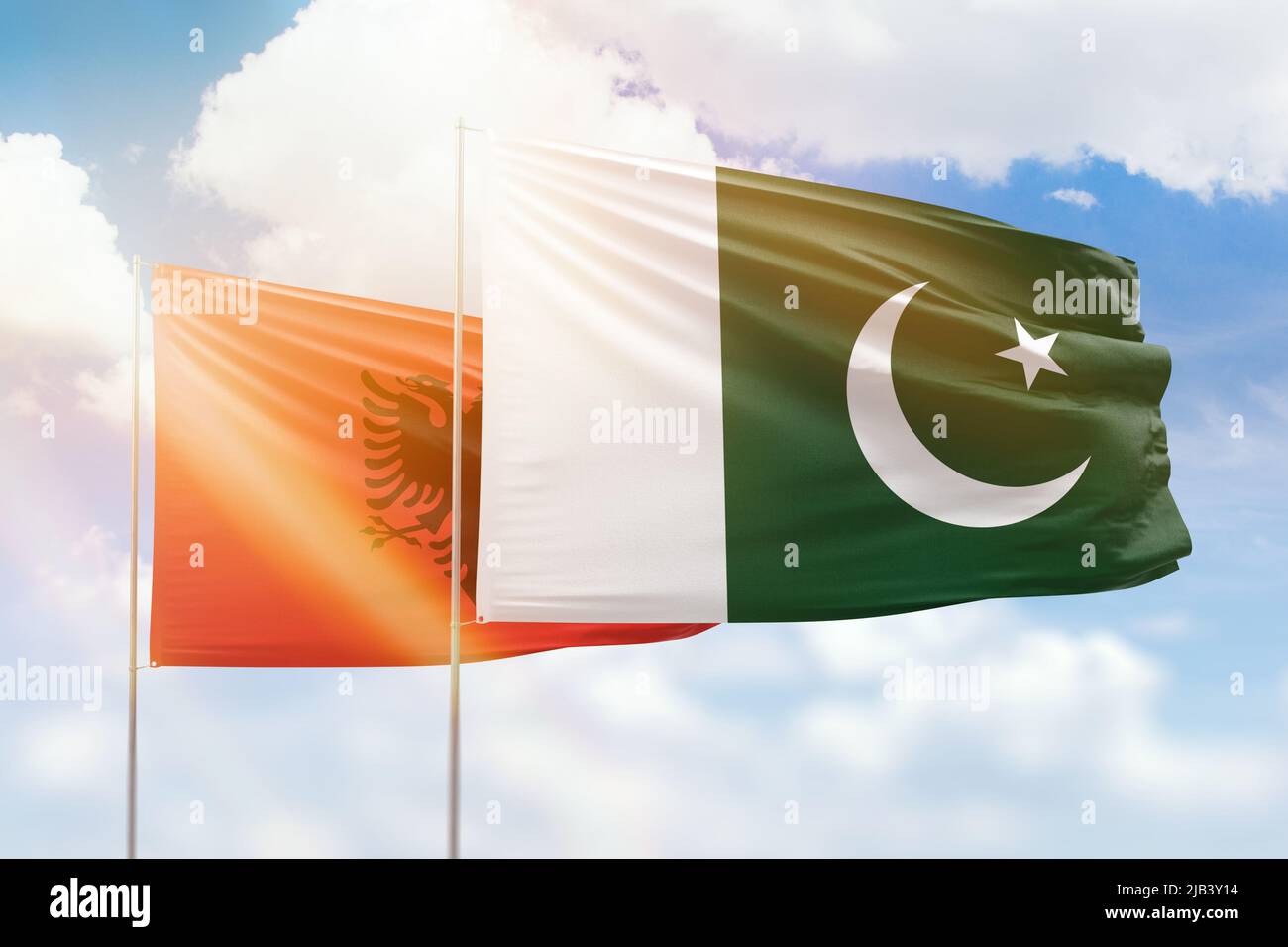 Sunny blue sky and flags of pakistan and albania Stock Photo - Alamy