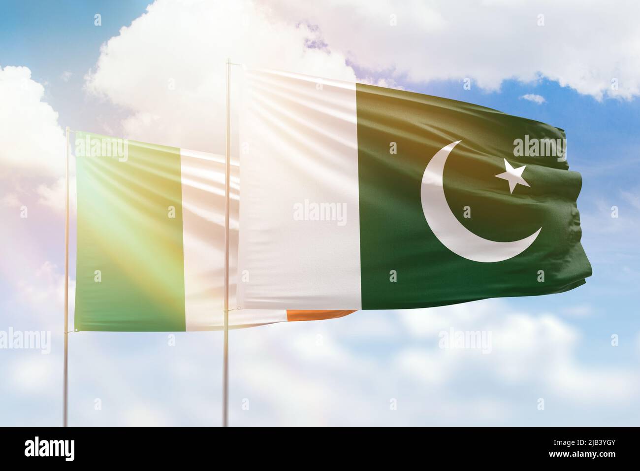 Sunny blue sky and flags of pakistan and ireland Stock Photo - Alamy