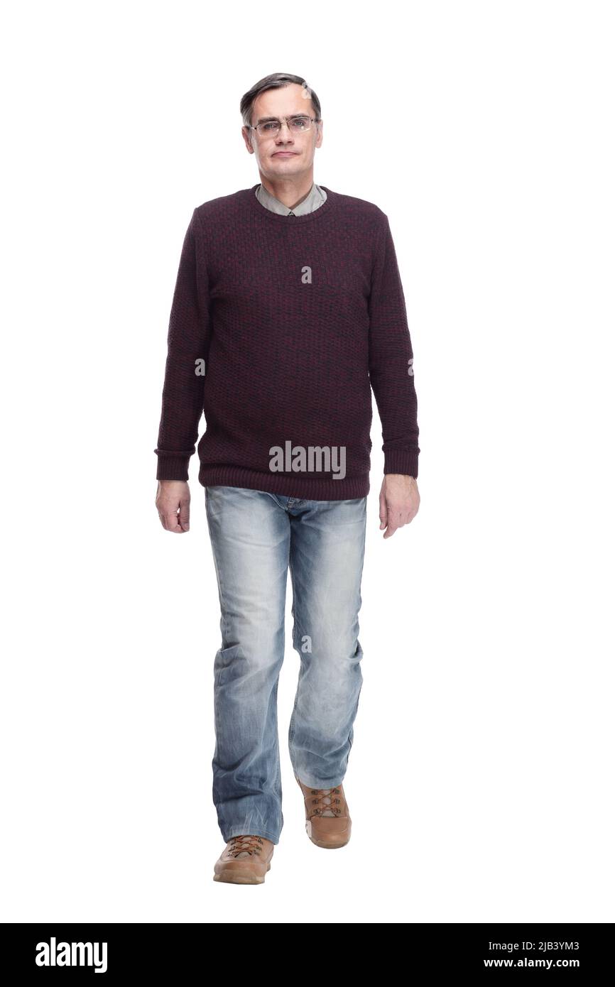 casual man in jeans and jumper striding forward . isolated on a white ...