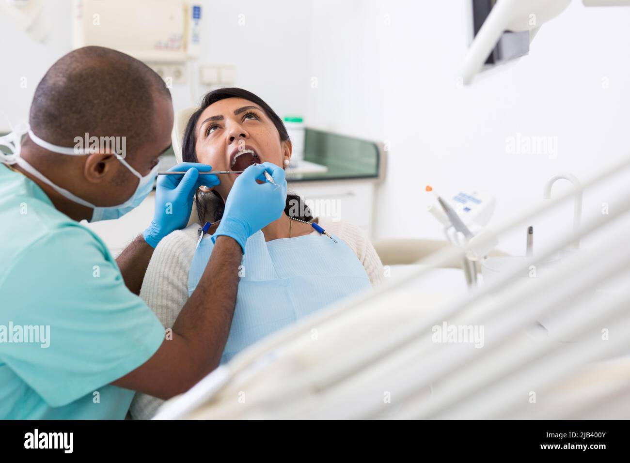 Female patient during dental checkup in dentist office Stock Photo - Alamy