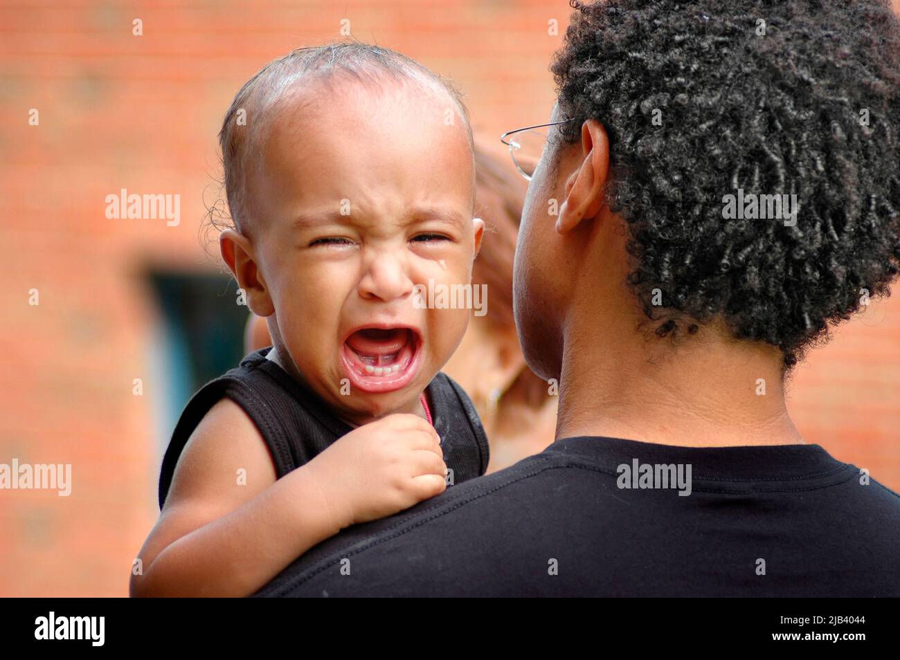 Kid crying with mother at school hi-res stock photography and images ...