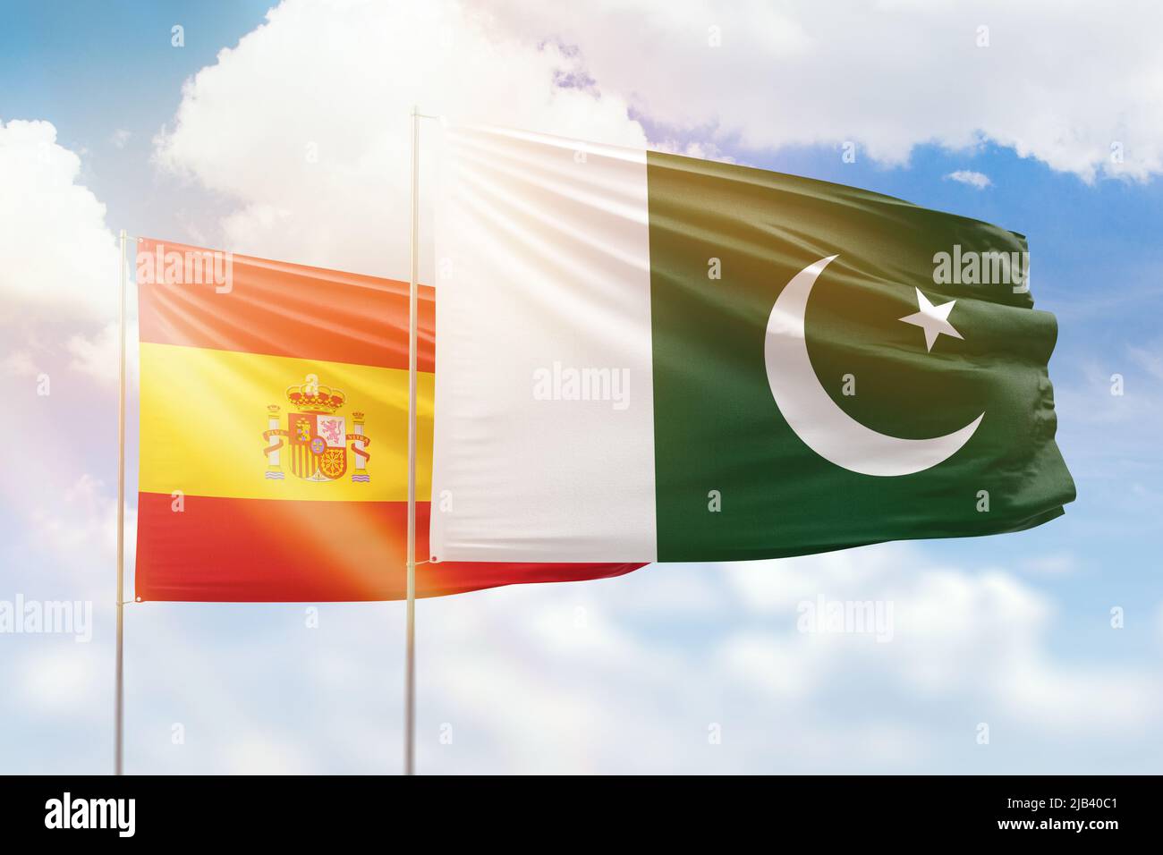Sunny blue sky and flags of pakistan and spain Stock Photo - Alamy