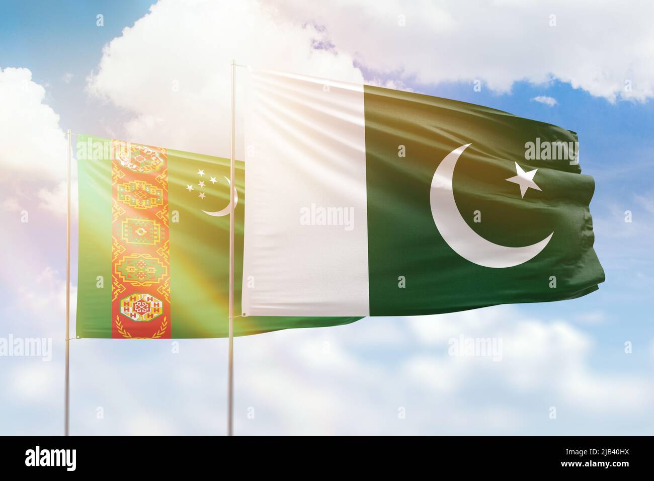 Sunny blue sky and flags of pakistan and turkmenistan Stock Photo - Alamy