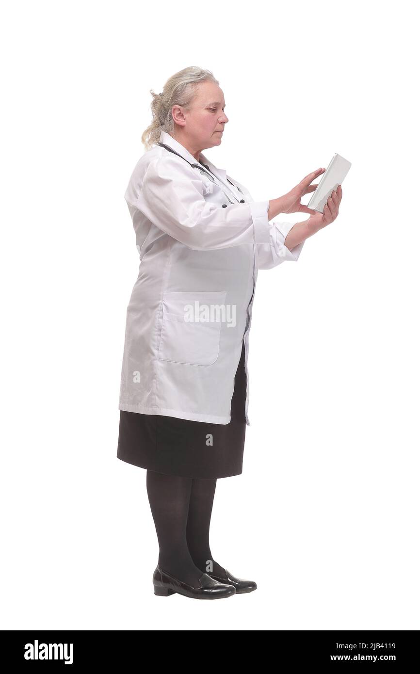 Side view of a doctor using a tablet computer - isolated over a white ...