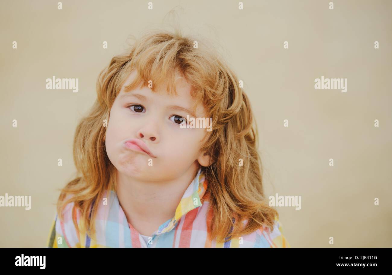 Child emotions. Unhappy confused kid. Childhood. Isolated. Funny boy ...