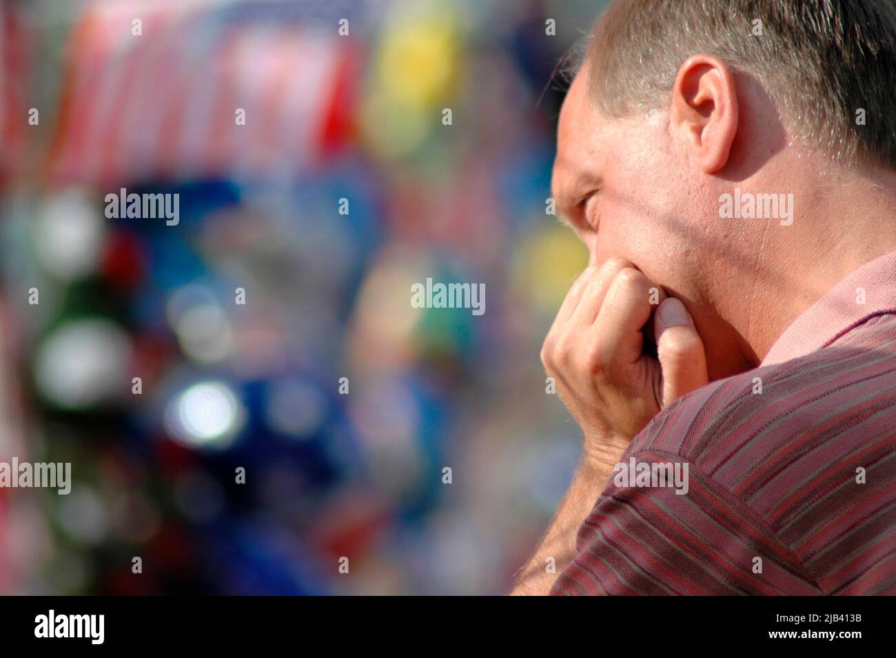pensive People at memorial for dead soldiers sad and looking at the ...